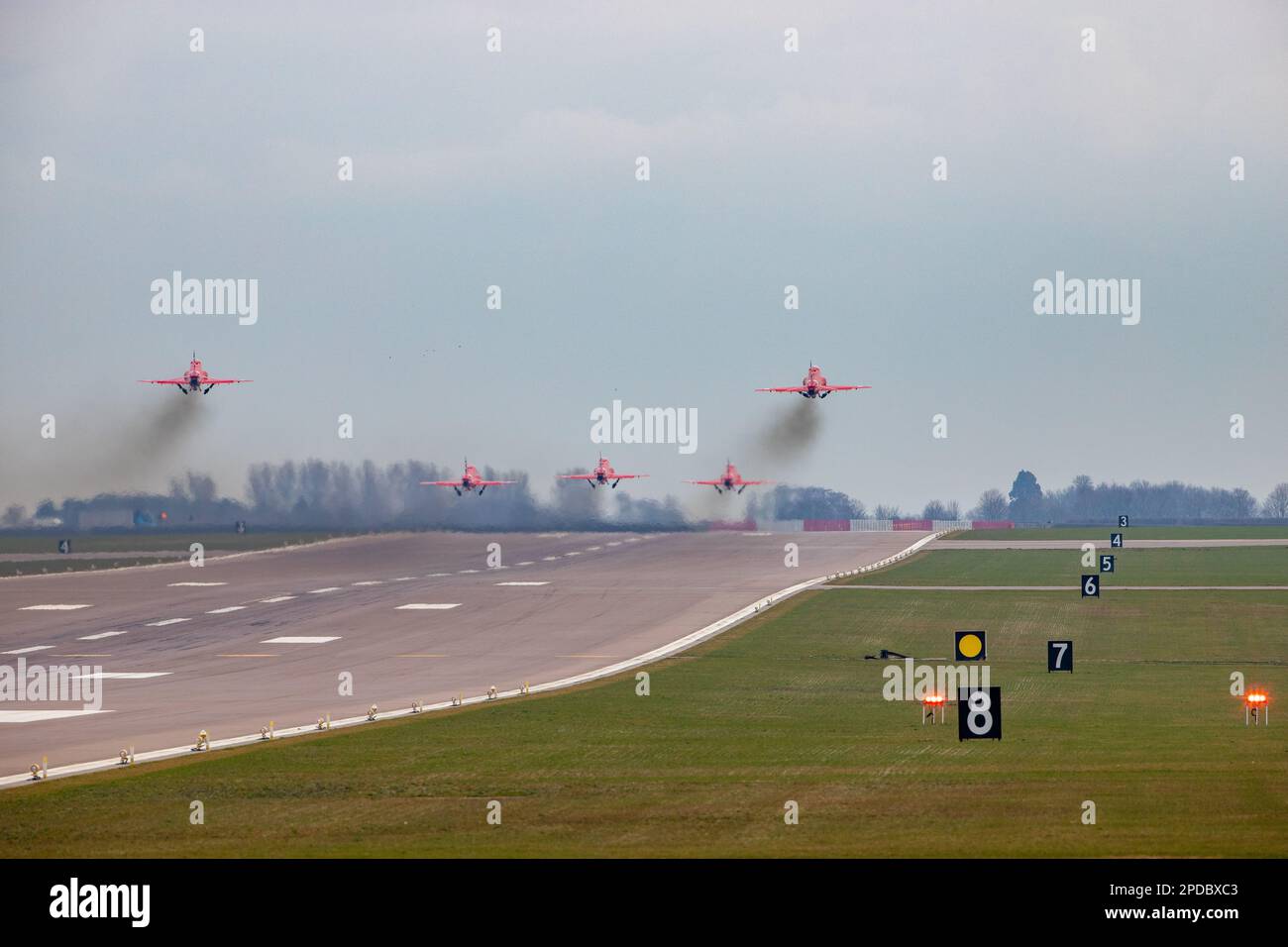 RAF Red Arrow taking off at RAF Waddington Stock Photo - Alamy