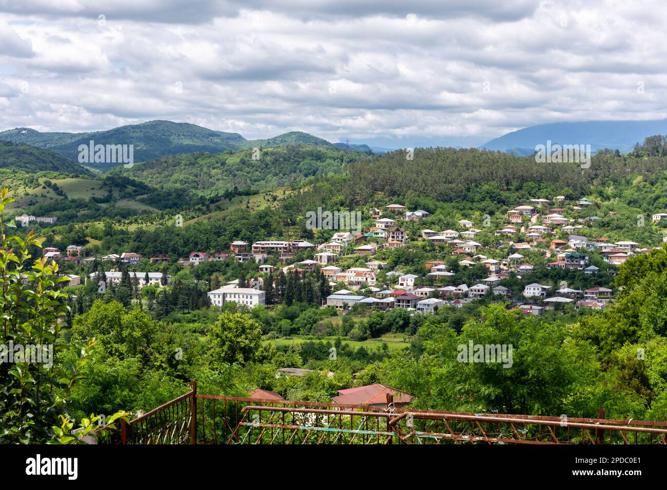 Landscape of Kutaisi rural outskirts with traditional residential ...
