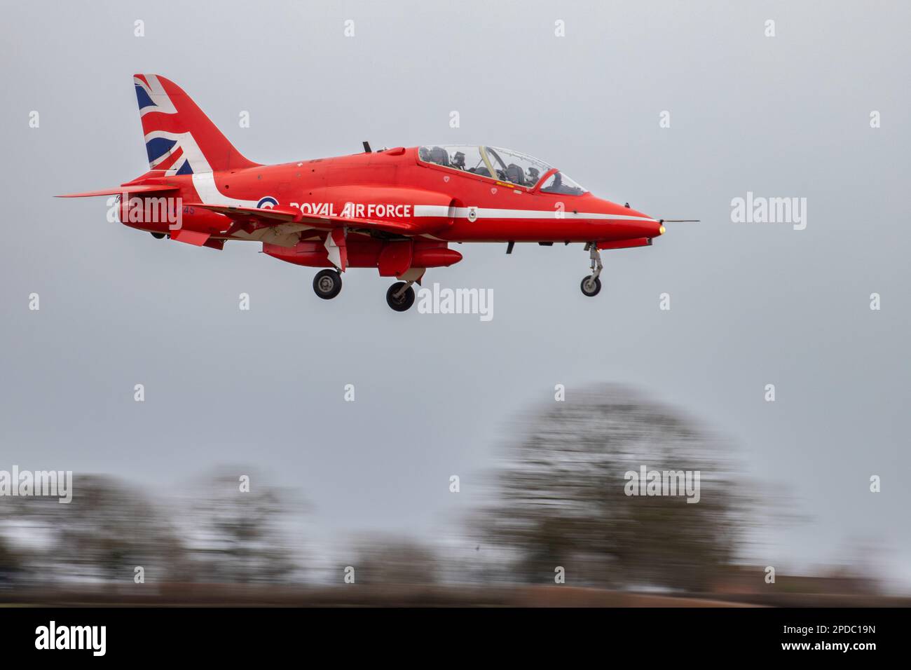 RAF Red Arrow coming in to land at RAF Waddington Stock Photo - Alamy