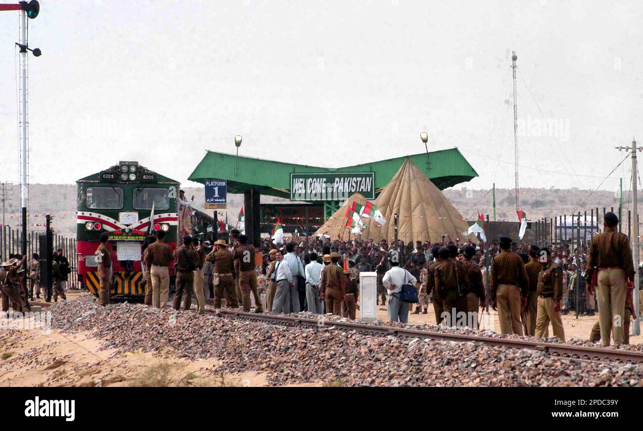 Indian paramilitary soldiers look on as the train from Khokrapar in ...