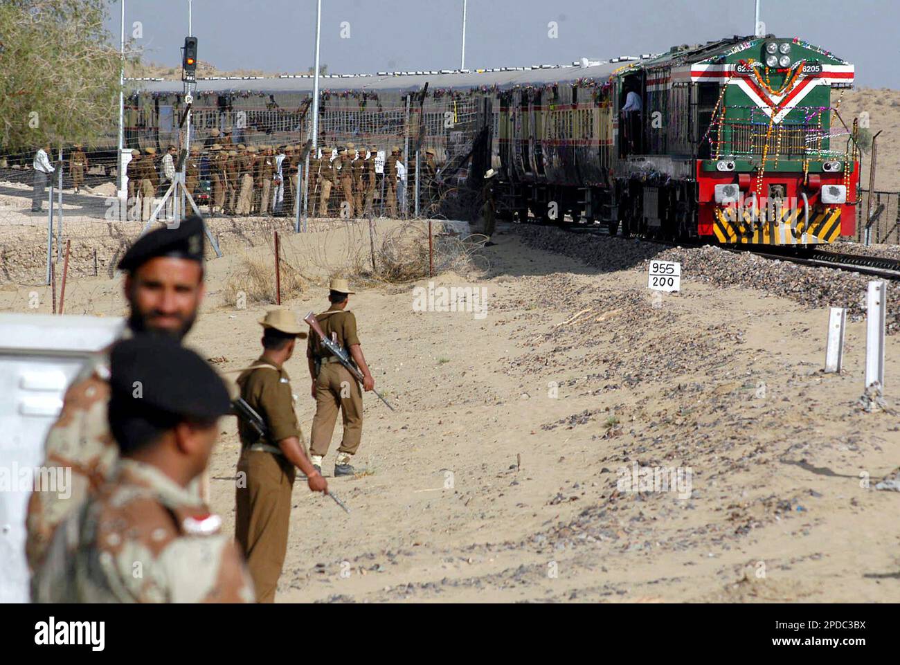 Soldiers of the Indian Border Force looks at the Pakistani passenger ...