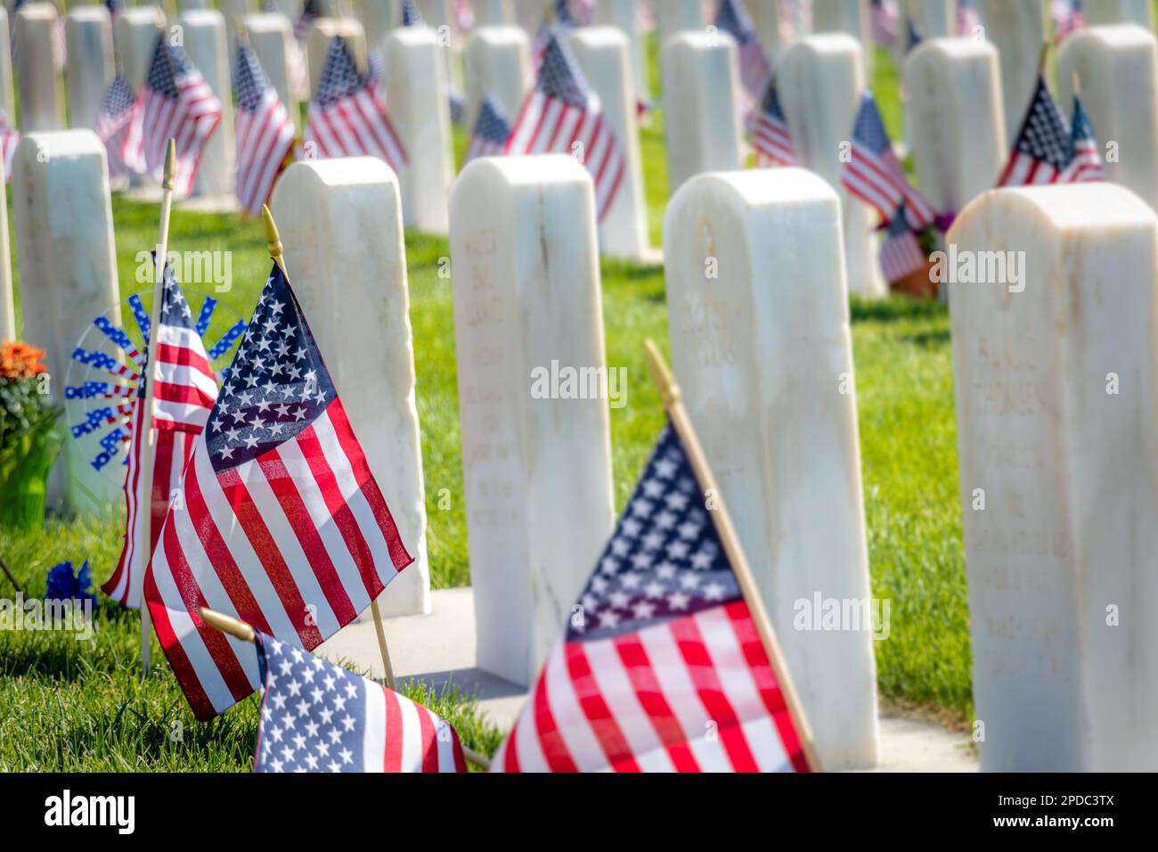 Military headstones honoring armed forces servicemen decorated with ...