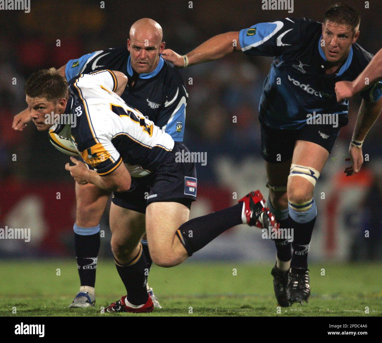 Australia's Brumbies Clyde Rathbone, left, runs with the ball as South ...
