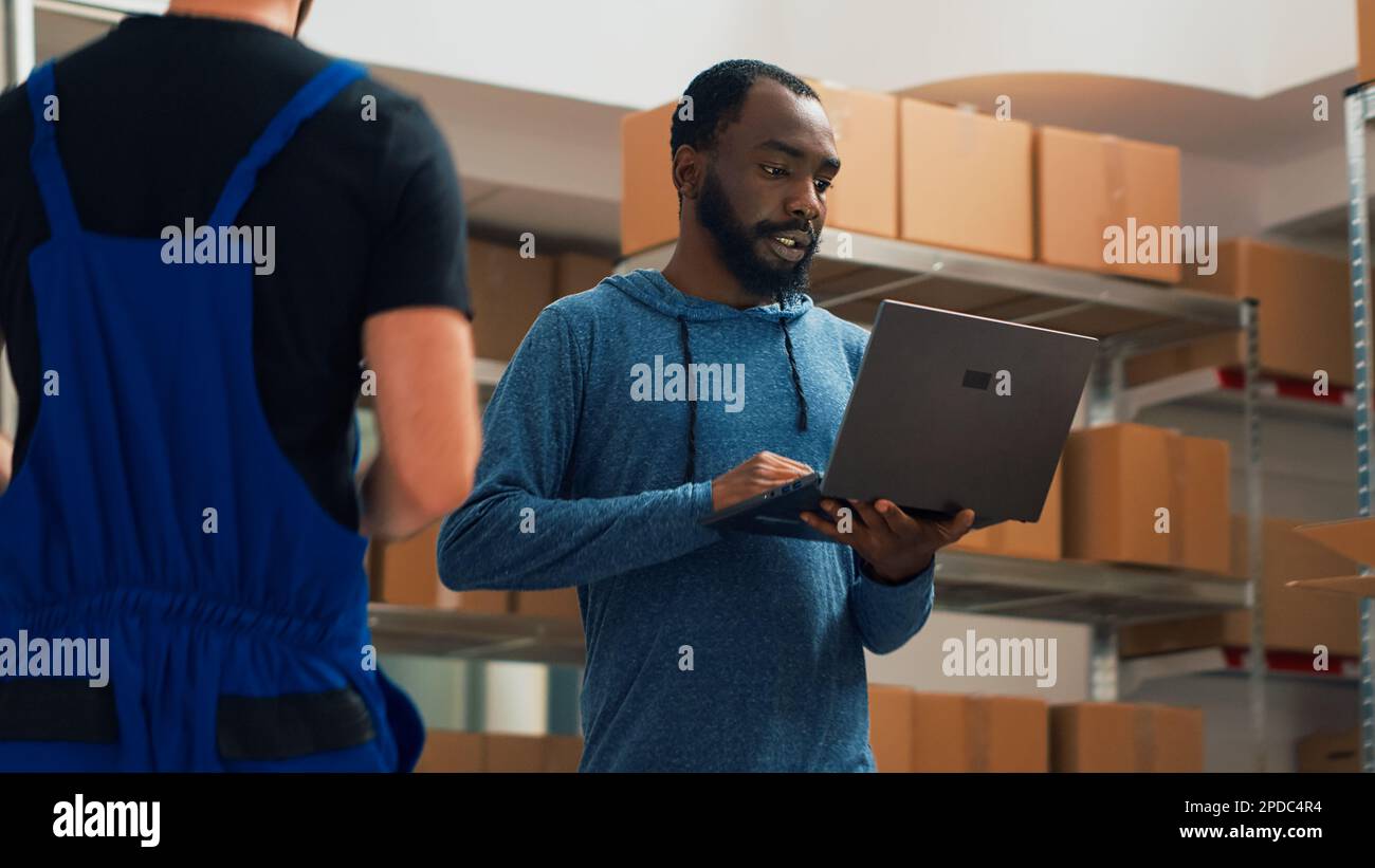 Warehouse employees doing cargo inventory and shipping stock ...