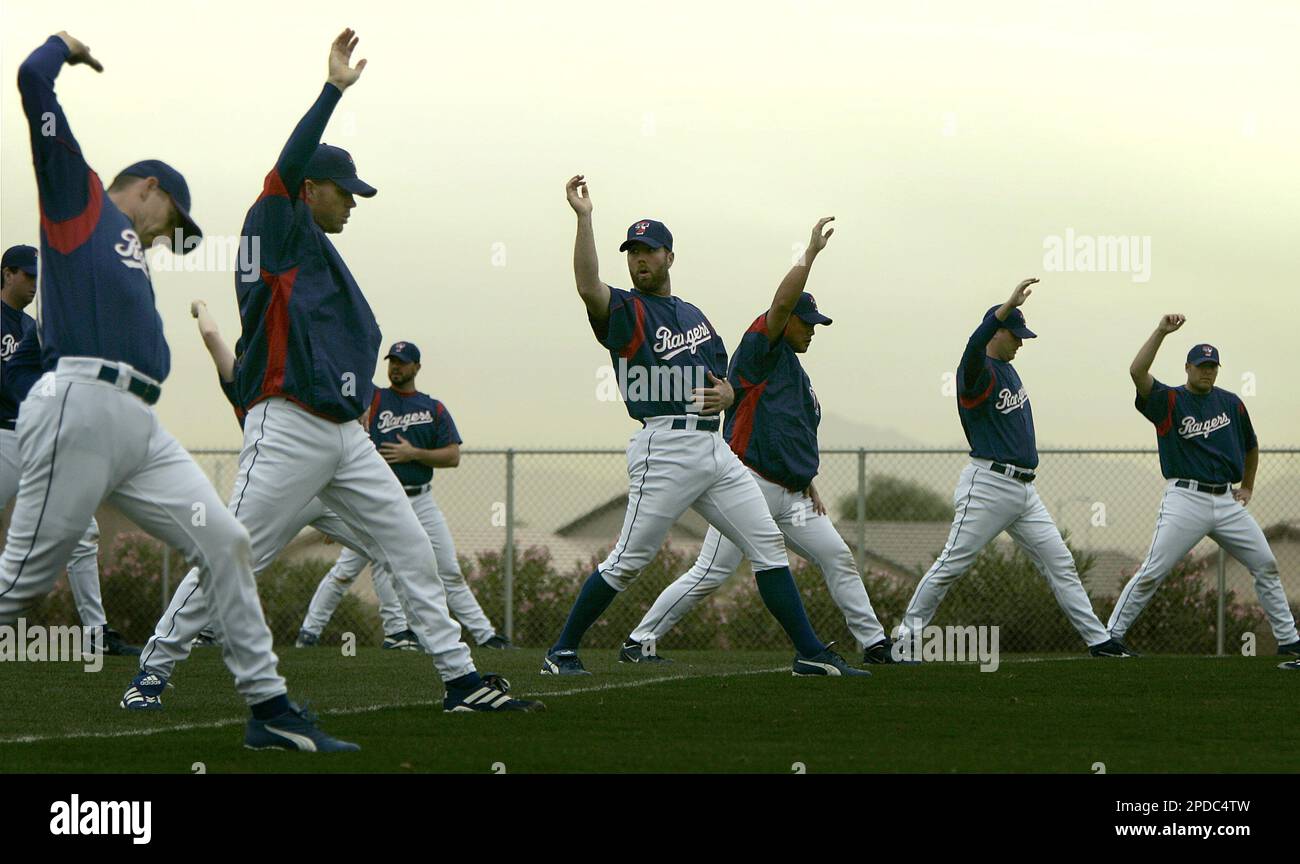 Texas Rangers' pitchers and catchers stretch during spring training at ...