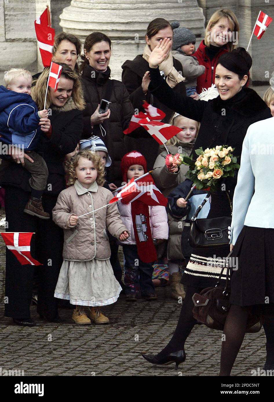 Danish Princess Mary, right, waves to the audience as she arrives at ...