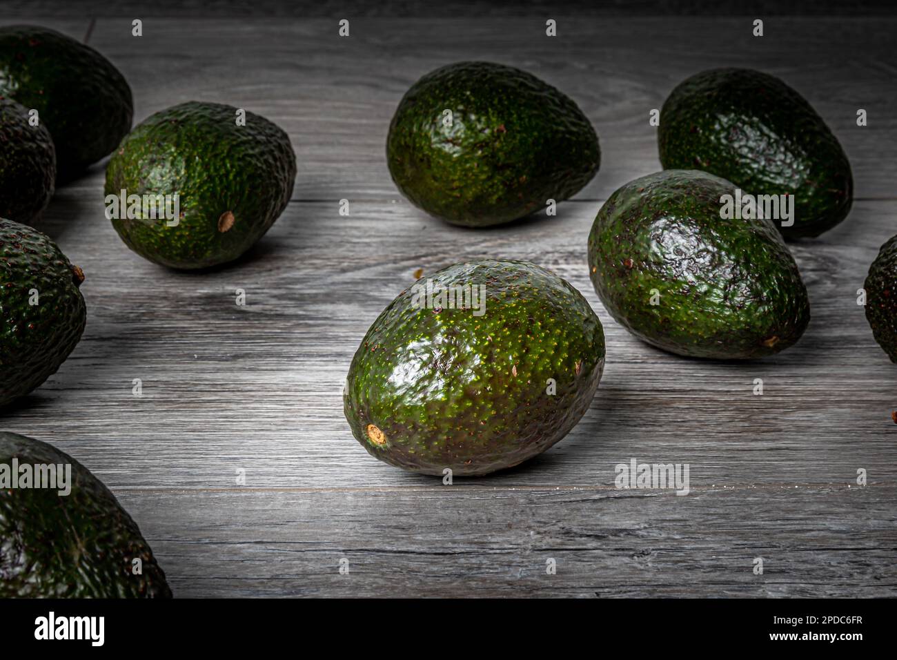 Extreme Close up of Avocados on a Grey Wood Table Surface Stock Photo ...