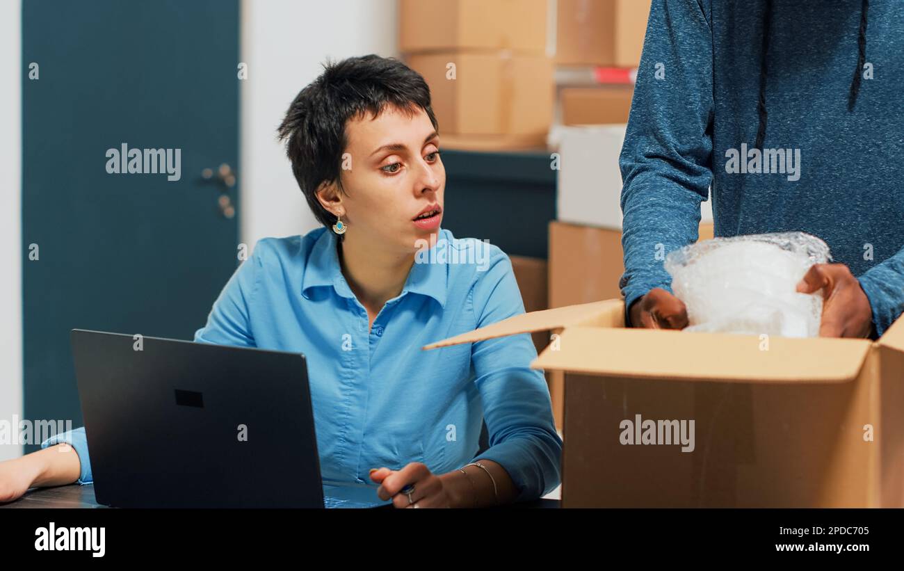 Diverse people working on shipment and business development, looking at ...