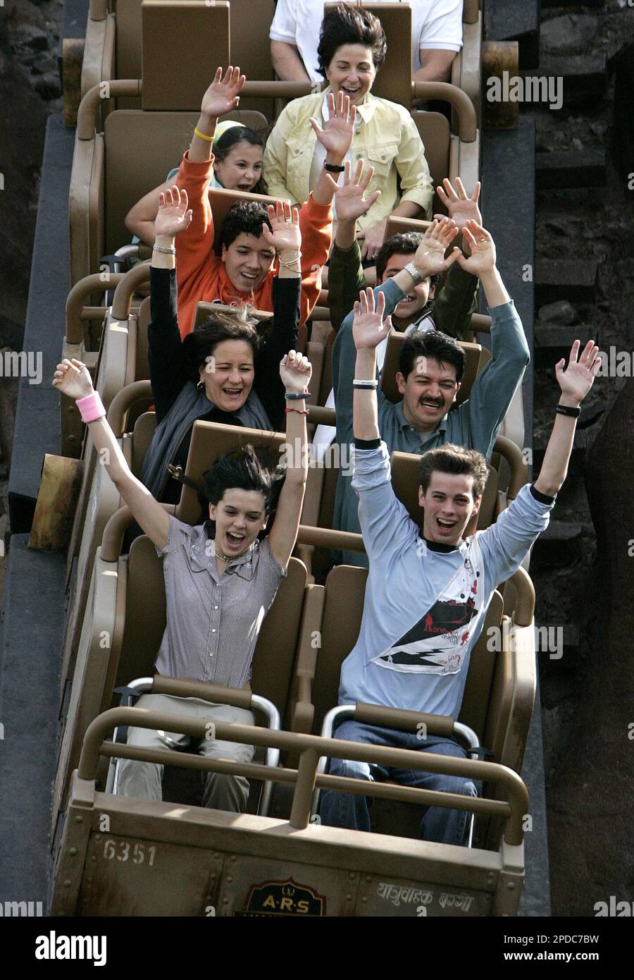 Visitors experience the 80-foot drop on the Expedition Everest roller ...