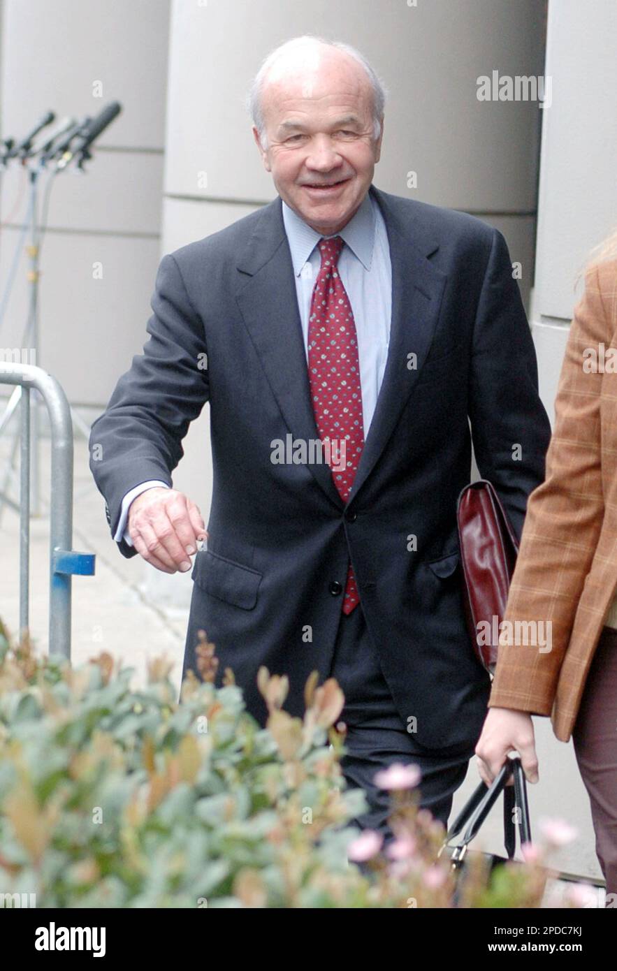 Enron founder Kenneth Lay leaves the federal courthouse in Houston ...