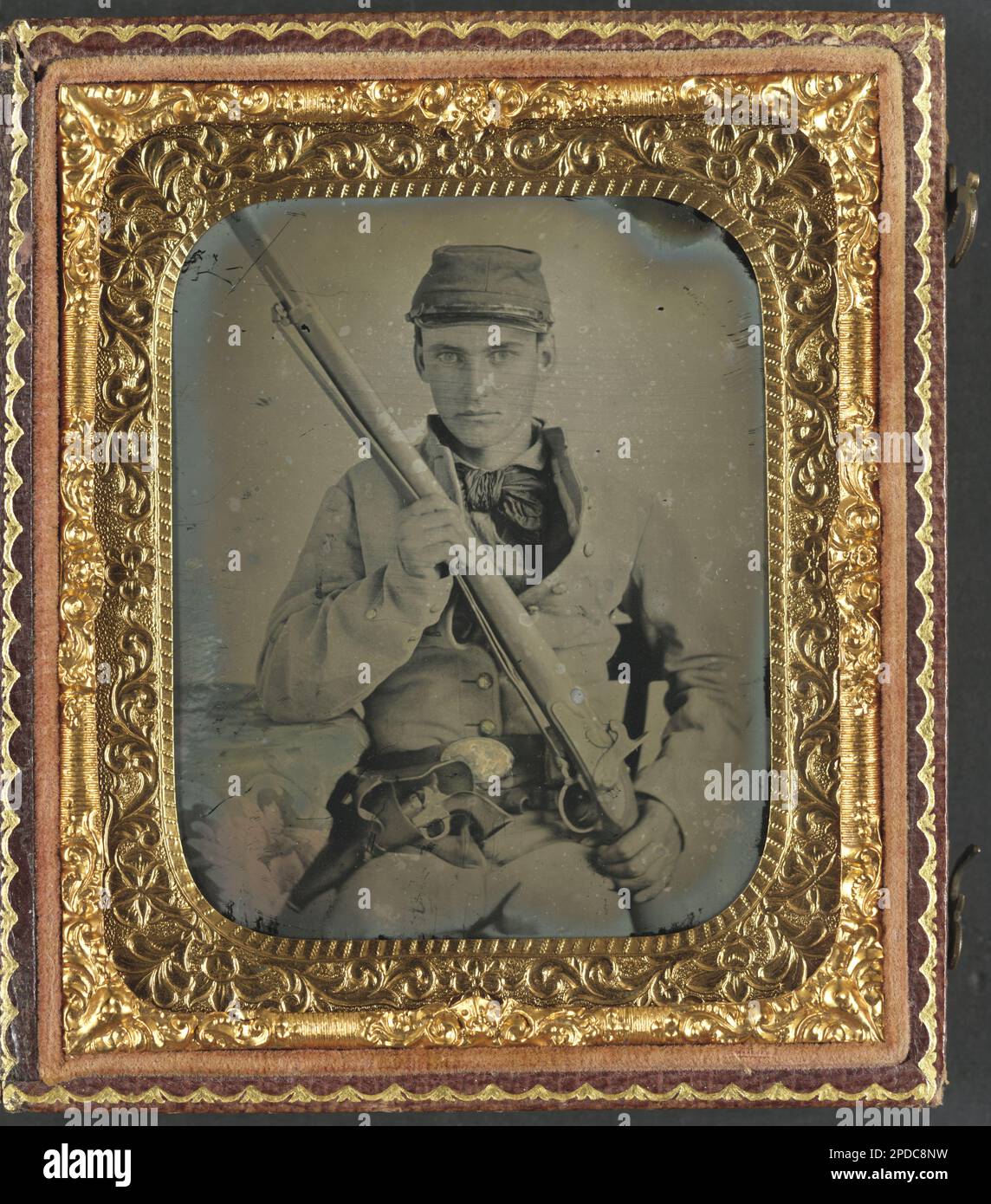 Unidentified soldier in Confederate infantry uniform with musket and ...