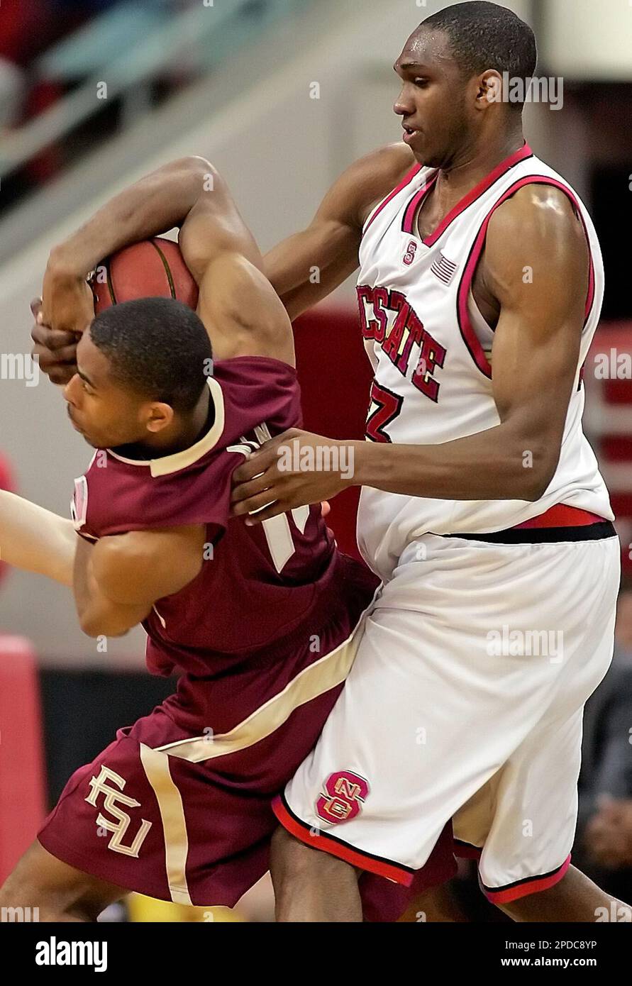 North Carolina State's Cedric Simmons, right, ties up Florida State's ...