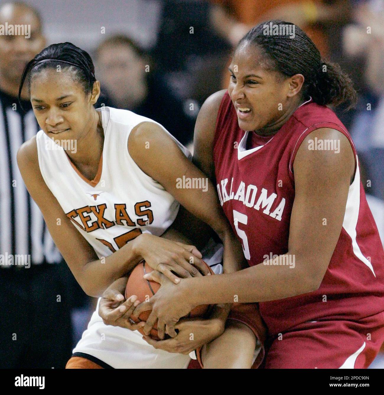 Texas forward Ashley Lindsey, left, battles for the ball with Oklahoma ...