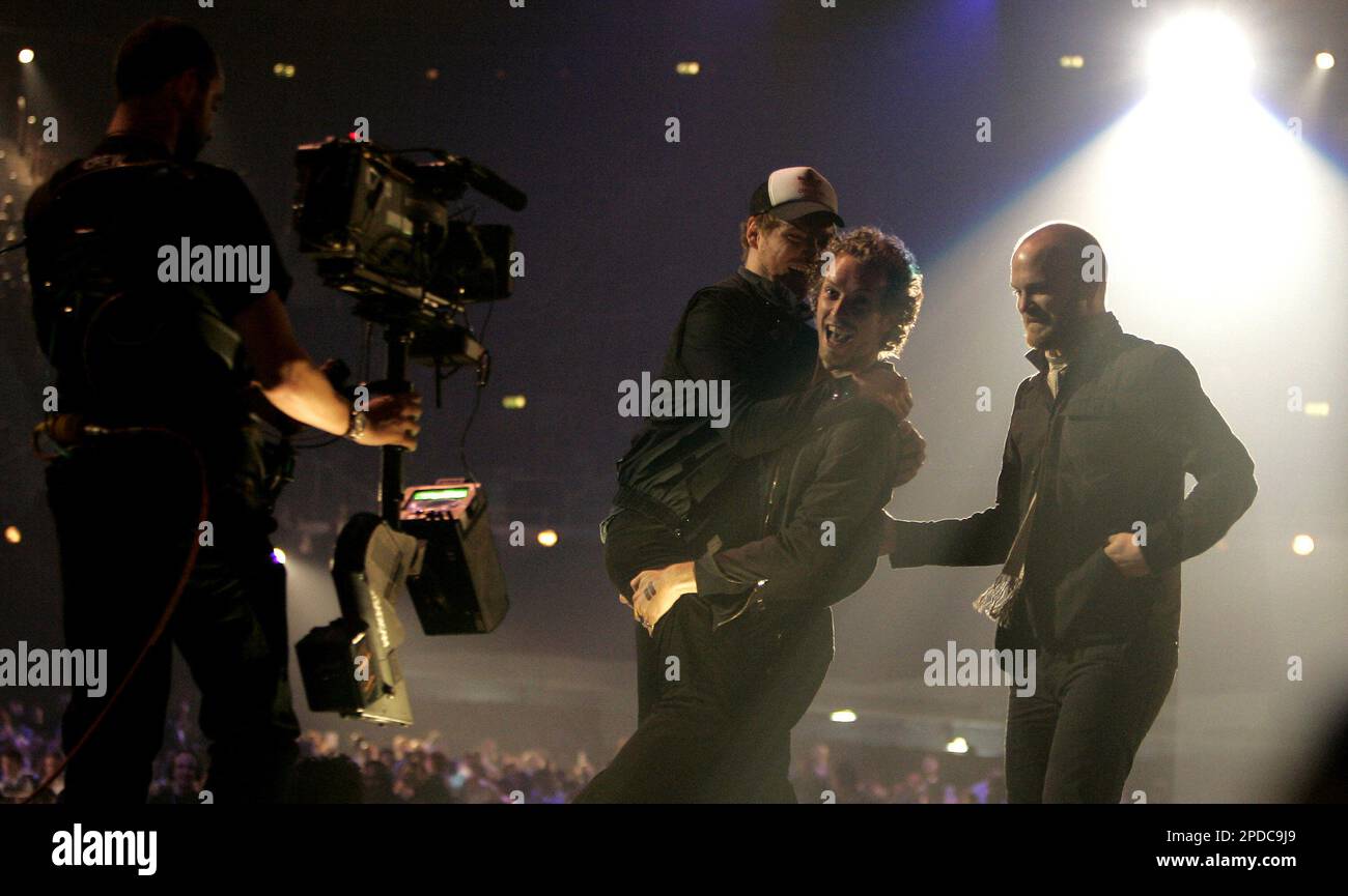British rock band Coldplay celebrate winning best British album at the ...