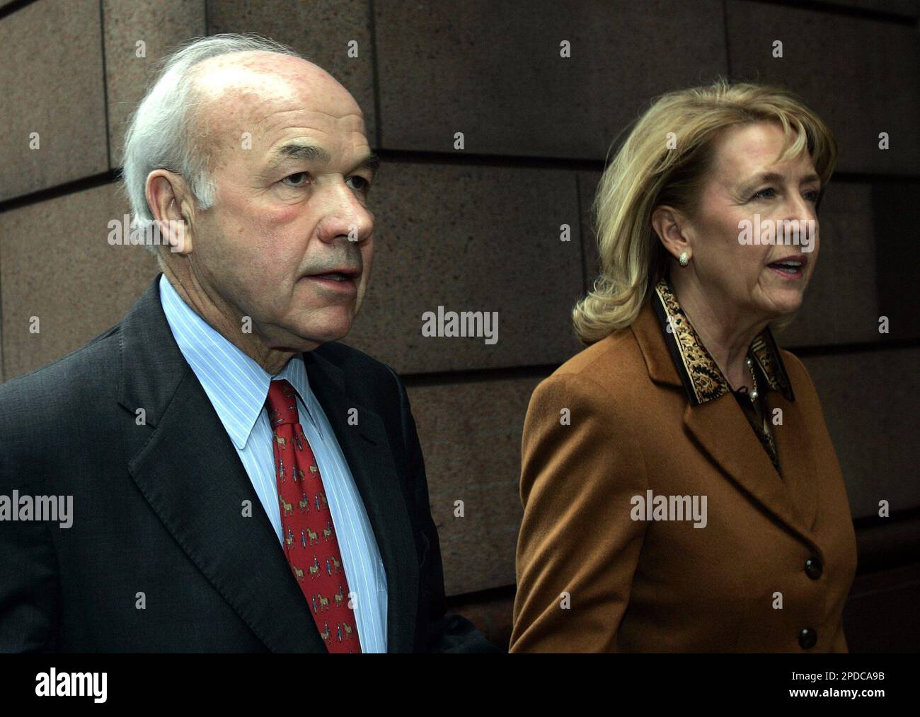 Former Enron CEO Kenneth Lay and his wife Linda walk from the federal ...