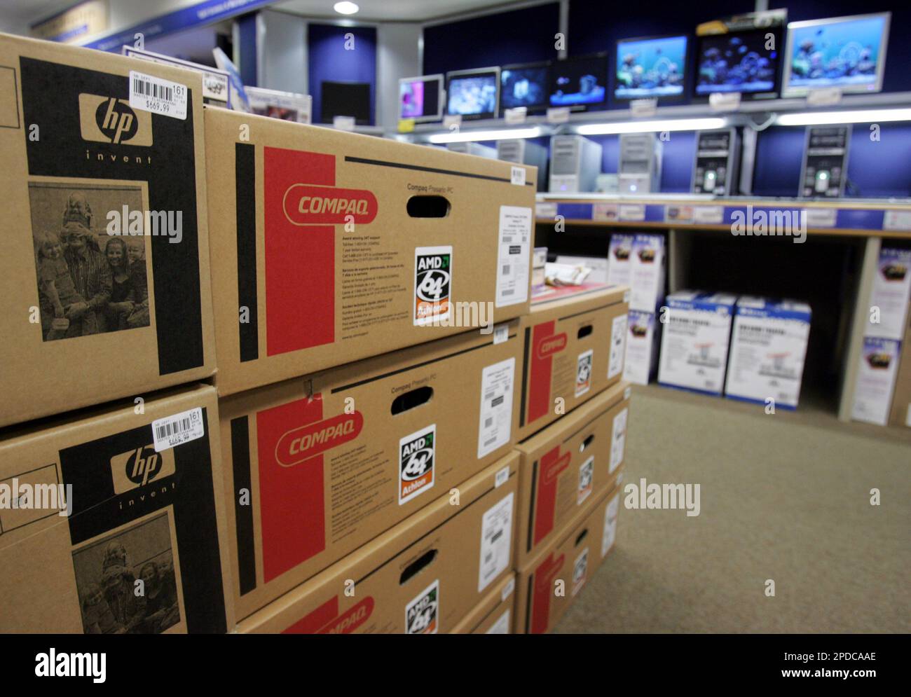 Boxes Hewlett-Packard Company computers, left, and their brand Compaq ...