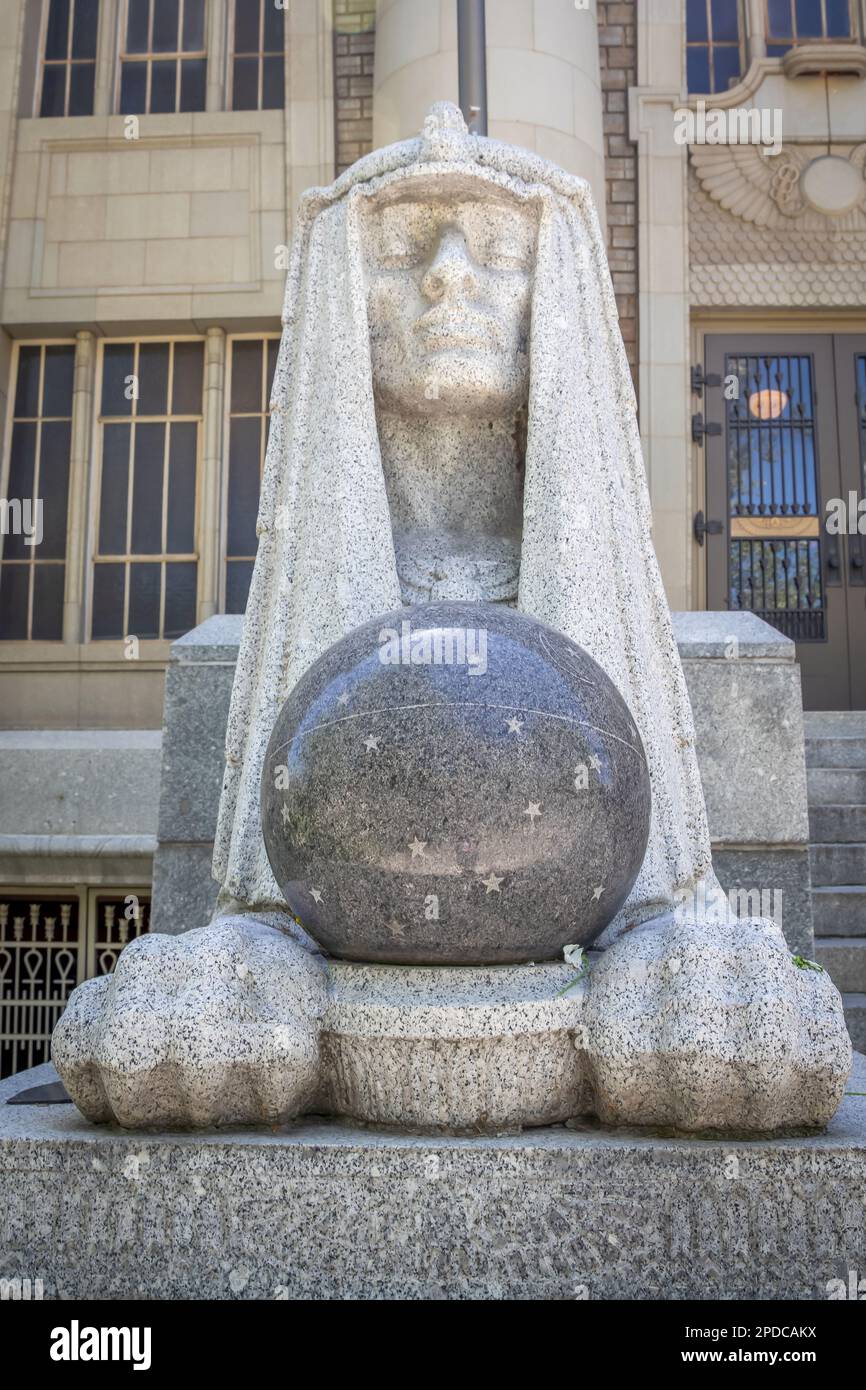 Granite statue of a sphinx holding an orb at a Masonic temple Stock ...