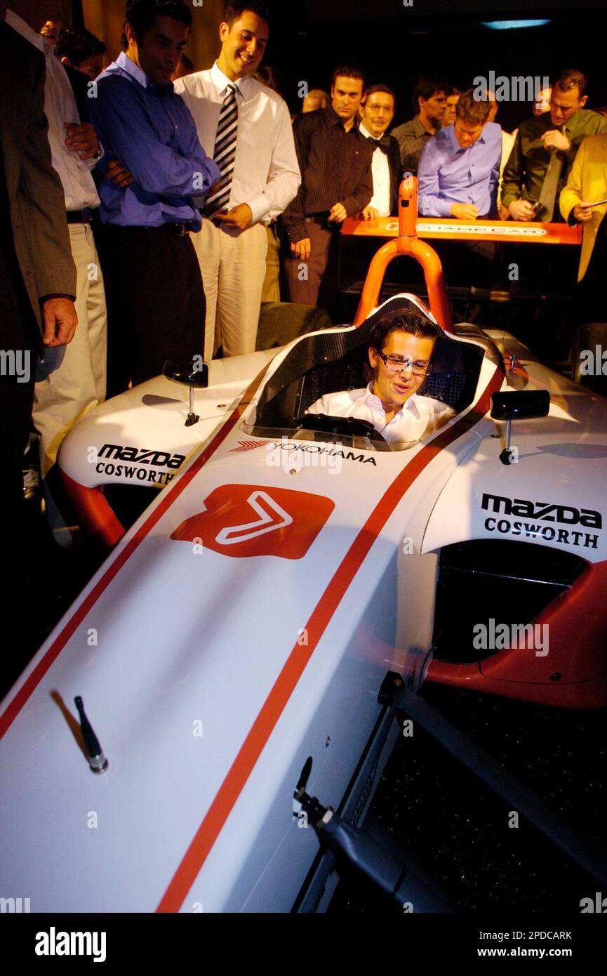 Race car driver Richard Phillipe, of France, sits in the cockpit of the ...