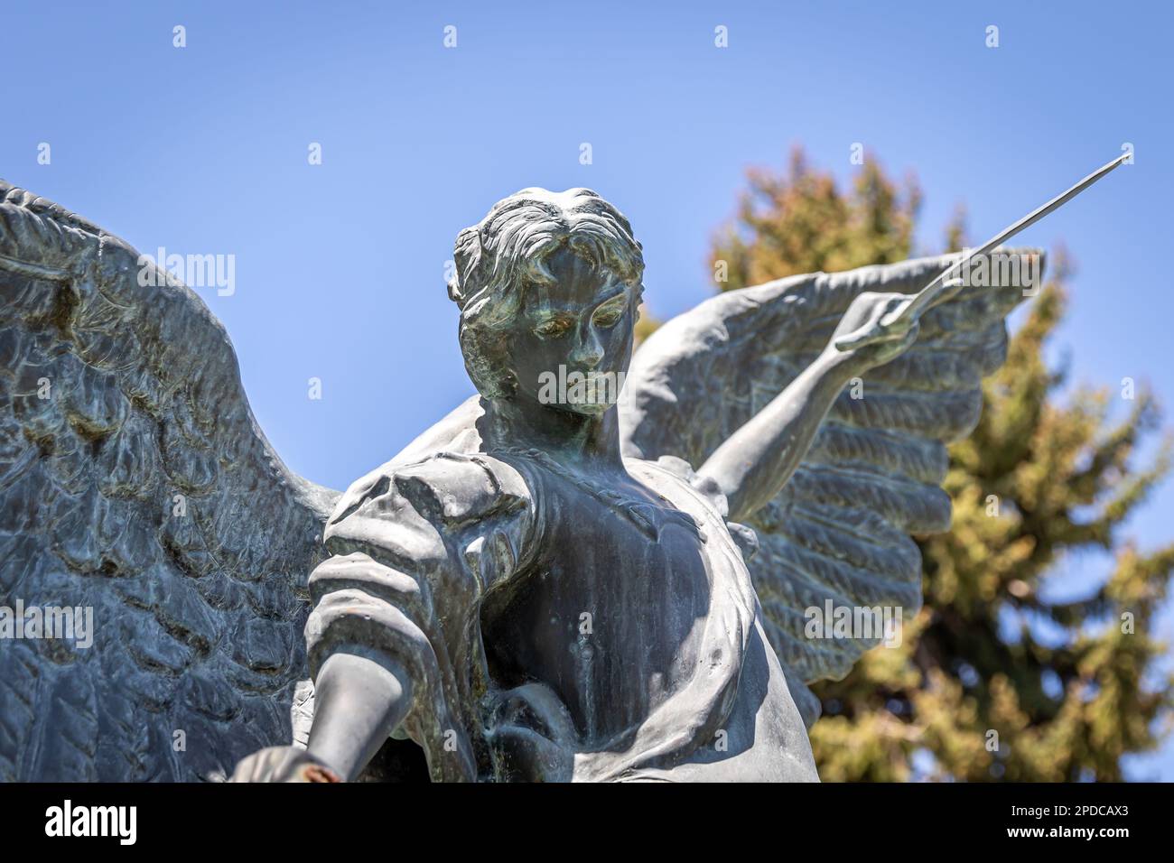 Statue of Micheal the Archangel statue holding a sword at the cemetery ...