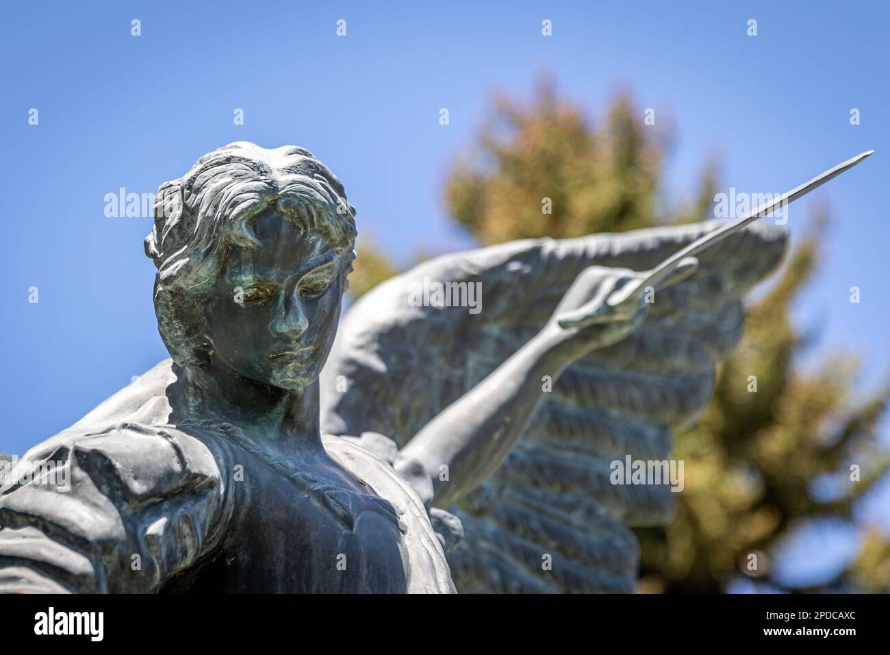 Statue of Micheal the Archangel statue holding a sword at the cemetery ...