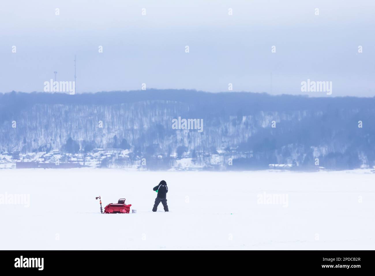 Ice fishing on Munising Bay off Sand Point in Pictured Rocks National ...