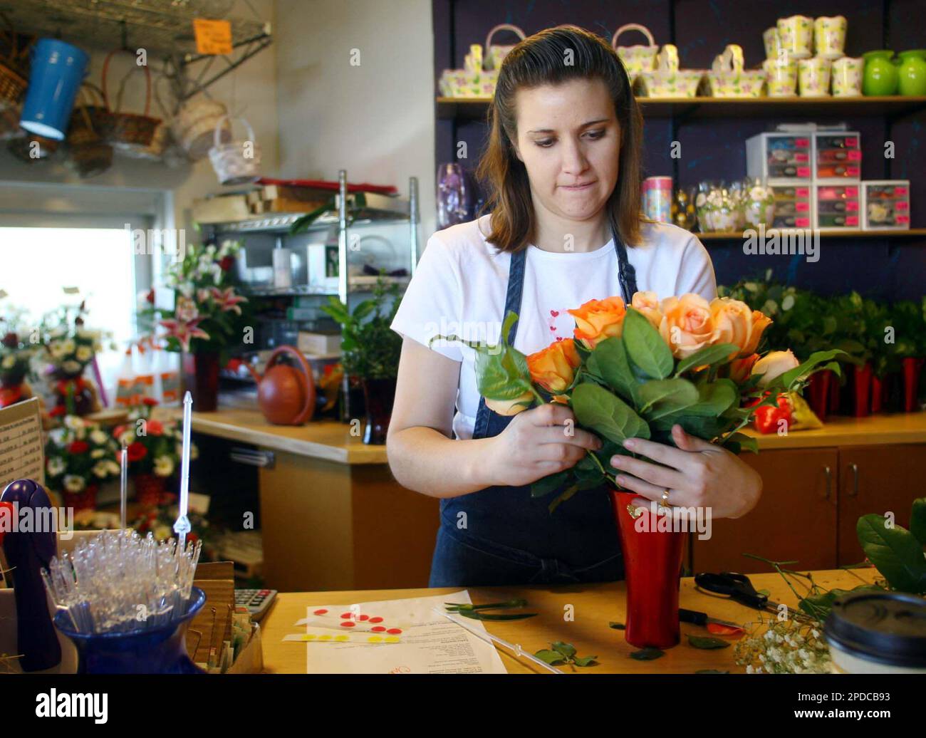 Jessica Paine, manager of A-Bo-Kay Flowers, works on a Valentine's Day ...