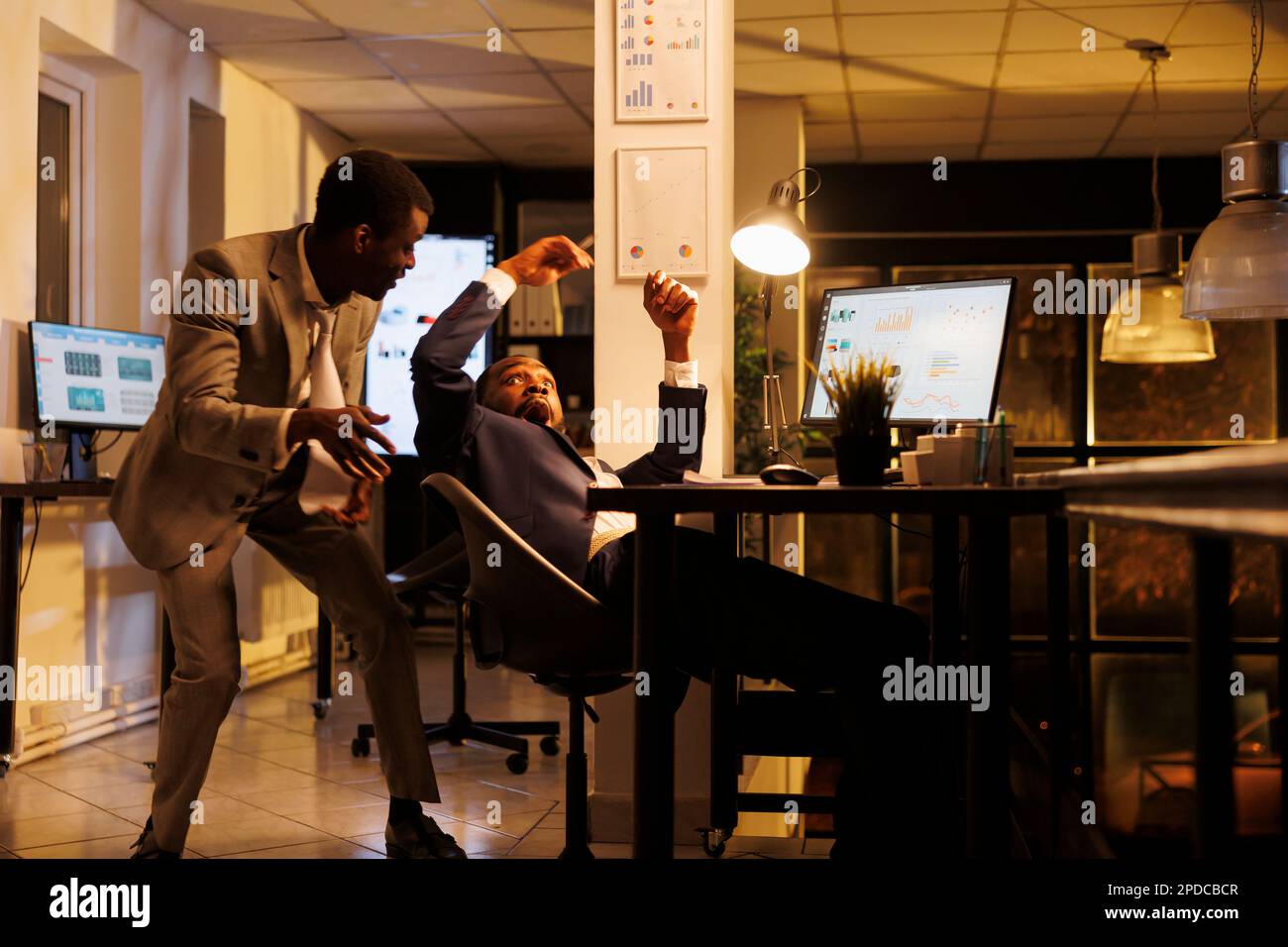 Playful employee scares his sleepy colleague in startup office, manager ...