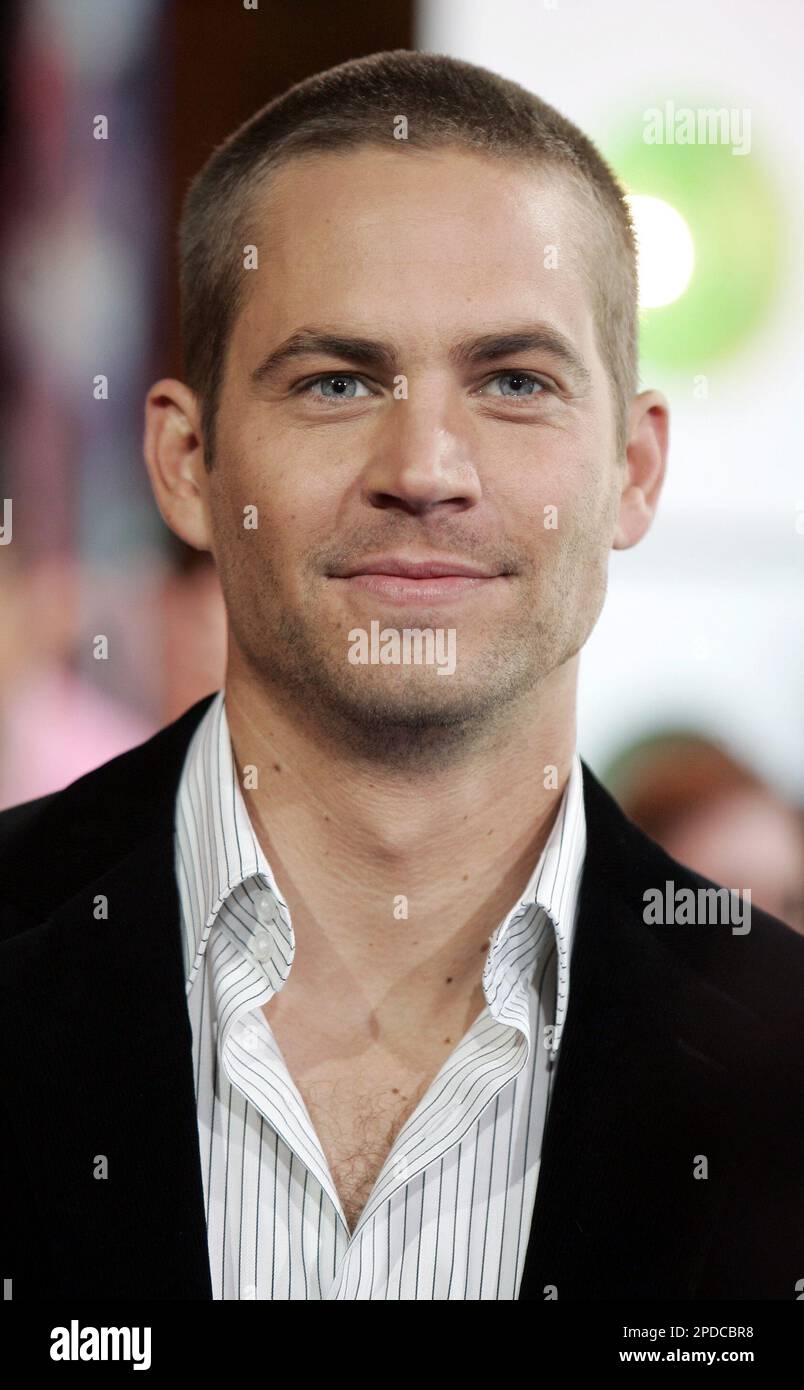 Actor Paul Walker, left, appears on stage during a taping for MTV's ...