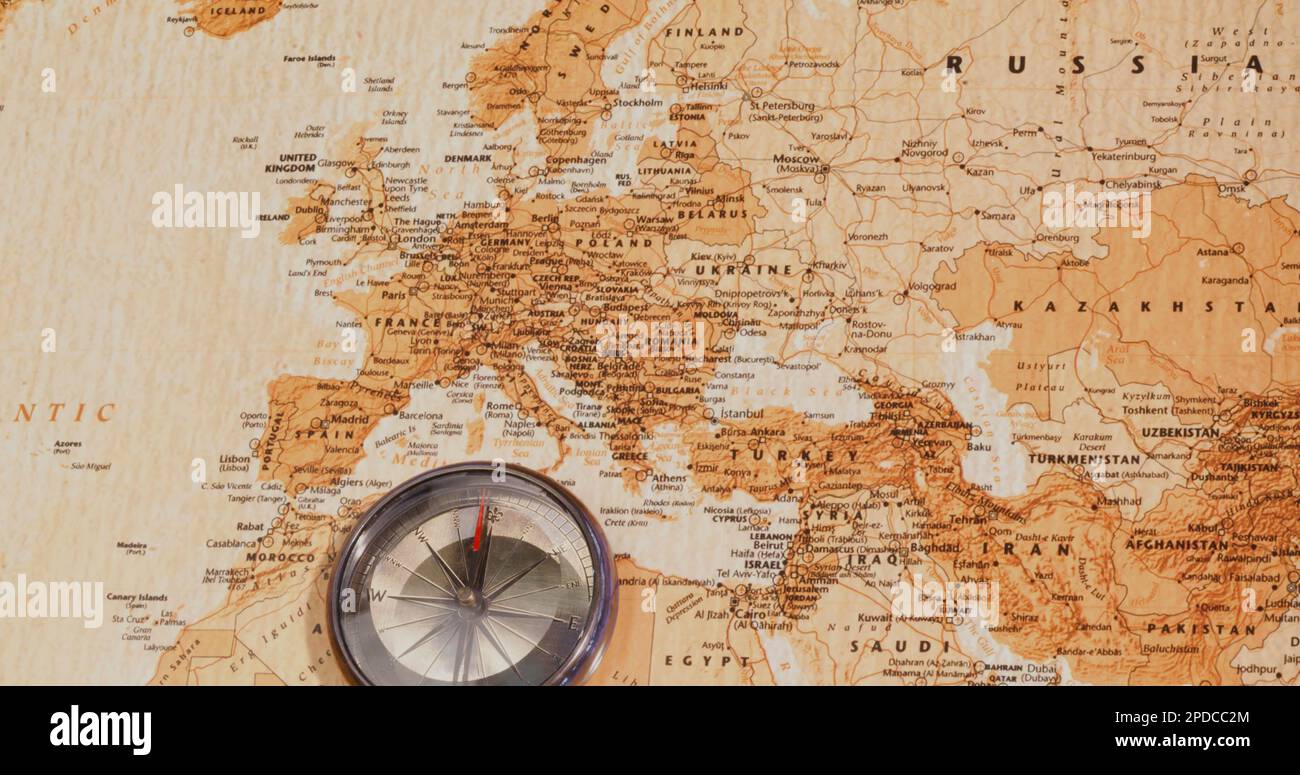 Image of compass lying on world map Stock Photo - Alamy