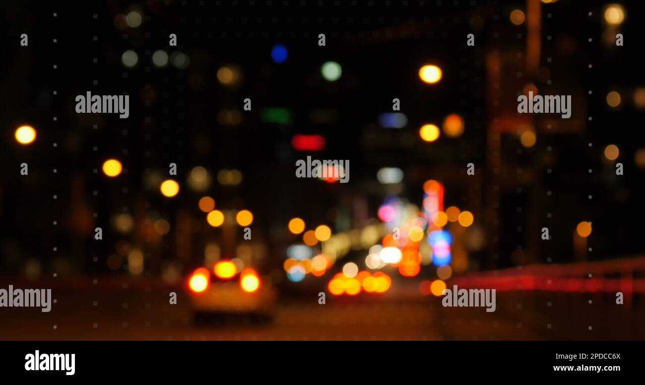 Blurred street with buildings, cars and light spots Stock Photo - Alamy