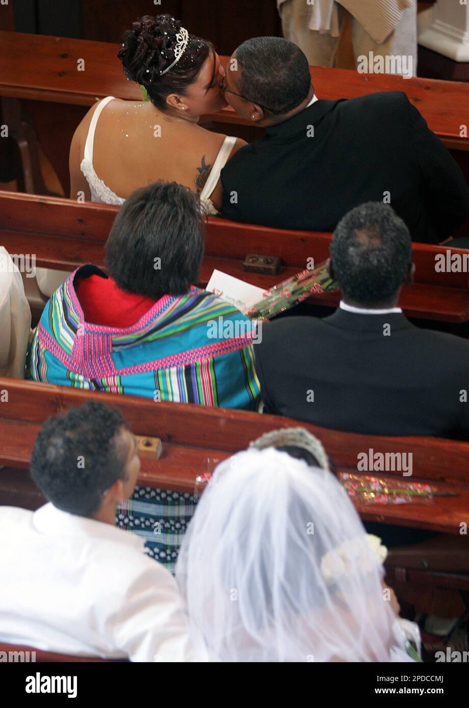 Neil Daniels, top right, and his fiance Valentia, top left, during a ...