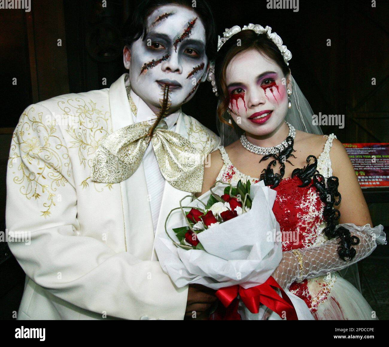 Scorpion queen Kanchana Ketkaew, right, and her bridegroom Bunthawee ...