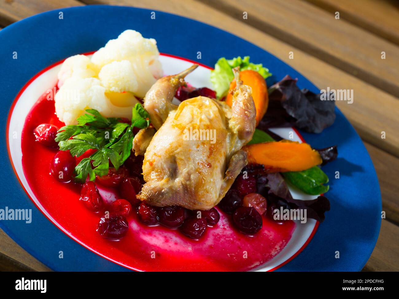 Grilled quail with sauce and vegetables Stock Photo - Alamy