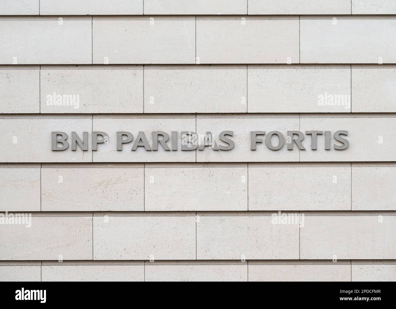 Brussels Old Town, Belgium - March 12, 2023 - Sign at the concrete wall ...