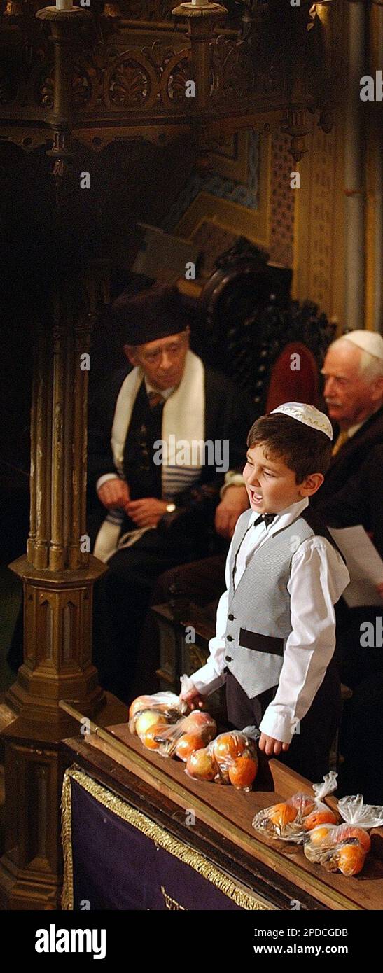 A boy of the Romanian Jewish community sings during celebrations of the ...