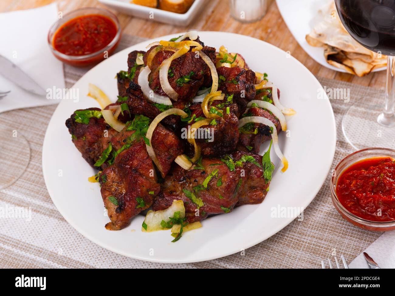 Oriental grilled pork meat shashlik Stock Photo - Alamy