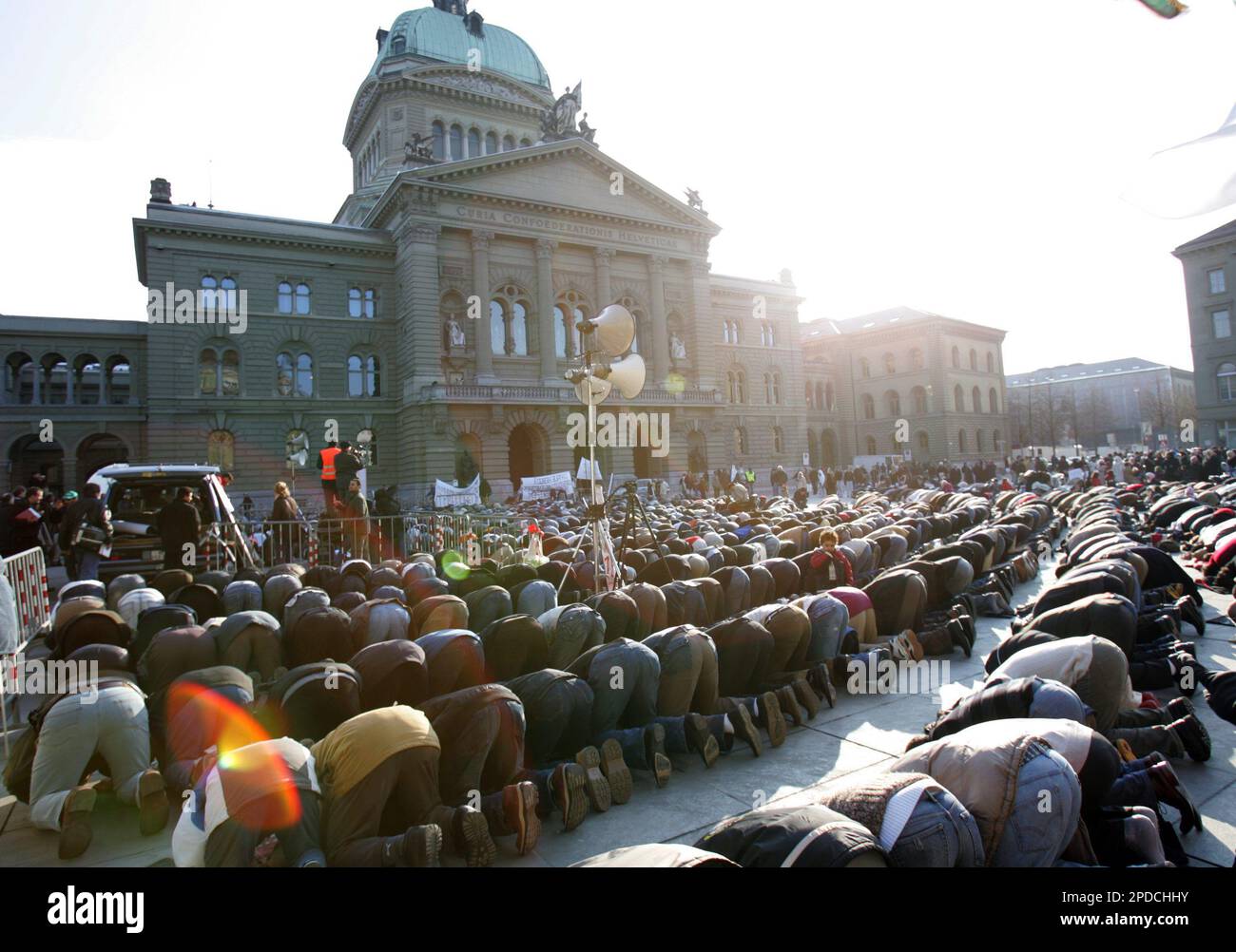 Protesters pray during a peaceful rally of Swiss Muslims, Saturday, Feb ...
