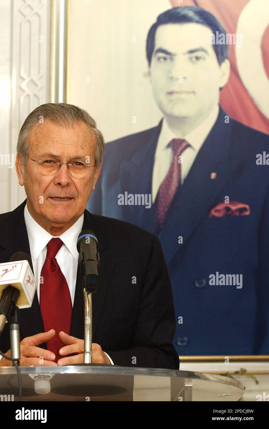 U S Defense Secretary Donald H Rumsfeld Speaks In Front Of A Portrait