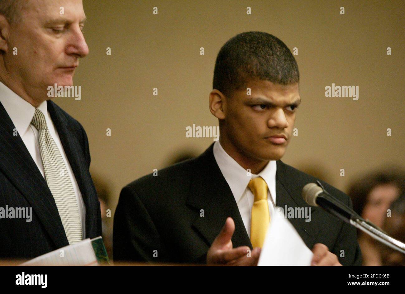 Attorney Michael Critchley, left, stands next to his client, Bruce ...