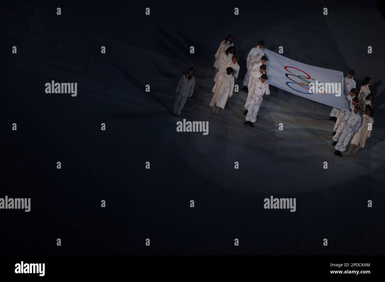 The Olympic flag is carried into the stadium during the opening ...