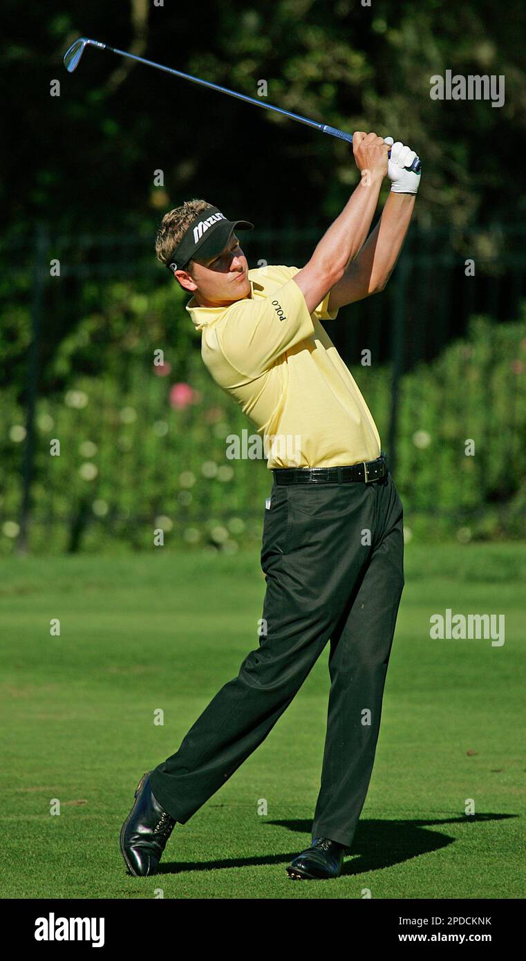 Luke Donald, of England, swings on the fairway on the first hole of the ...