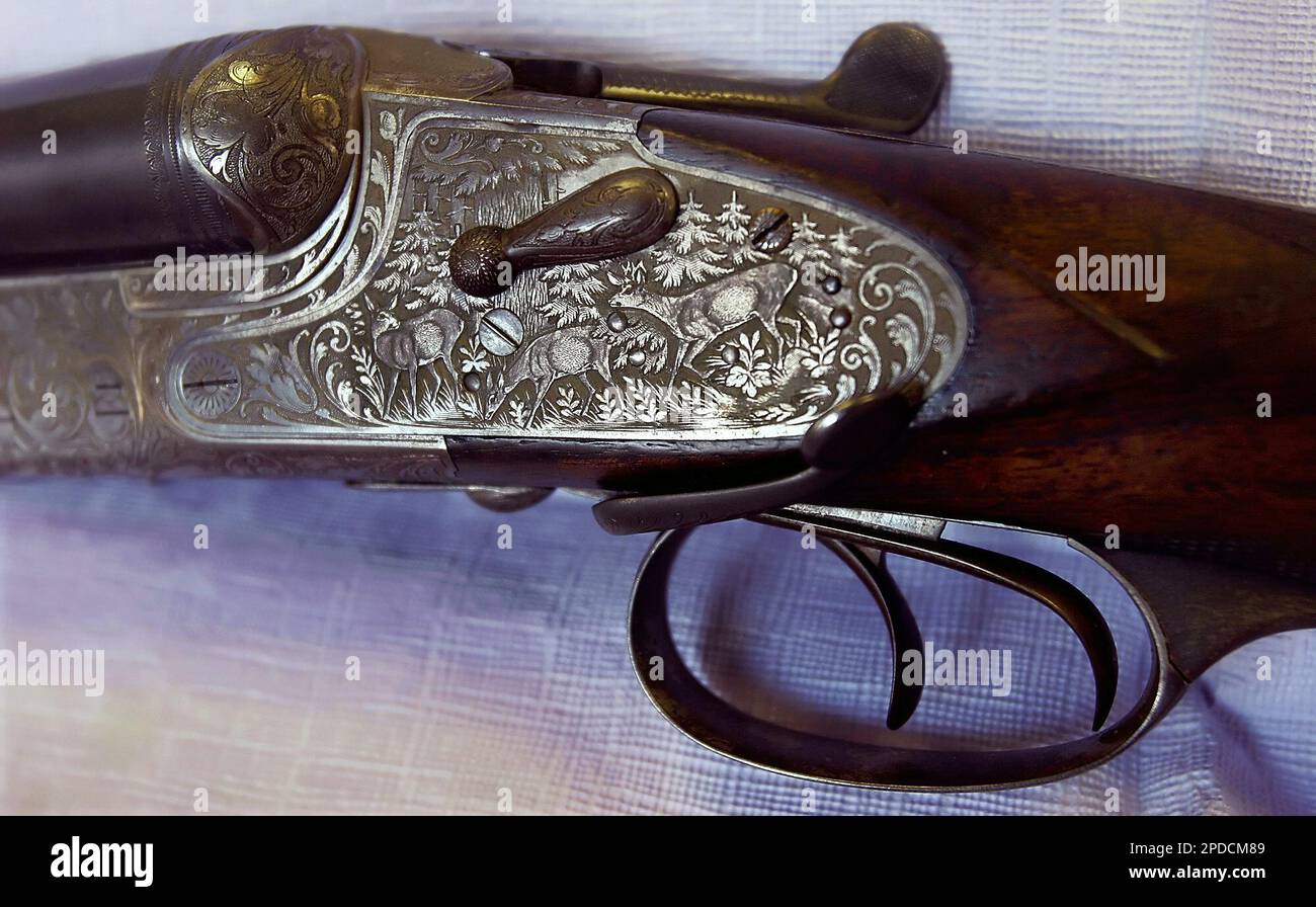 A detail of engravings on a Krieghoff Drilling shotgun/rifle that might ...