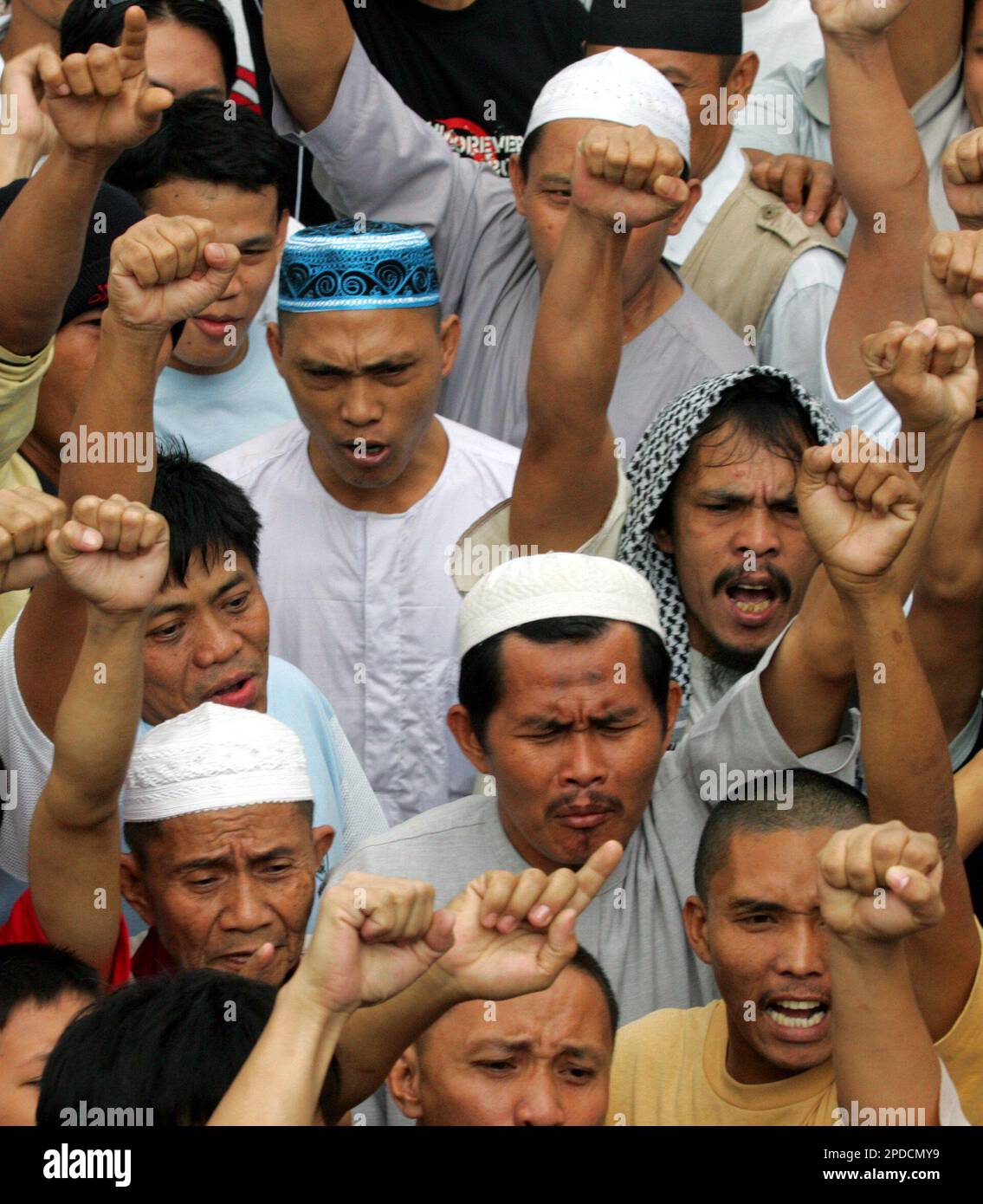 Filipino Muslims shout "Allahu Akbar" (God is Great!)" during a rally ...