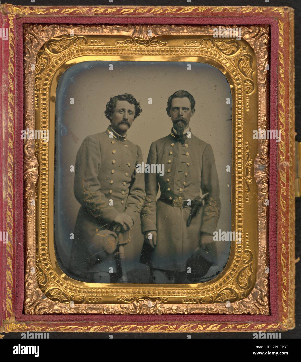 Two unidentified soldiers in Confederate uniforms with sword and pistol ...