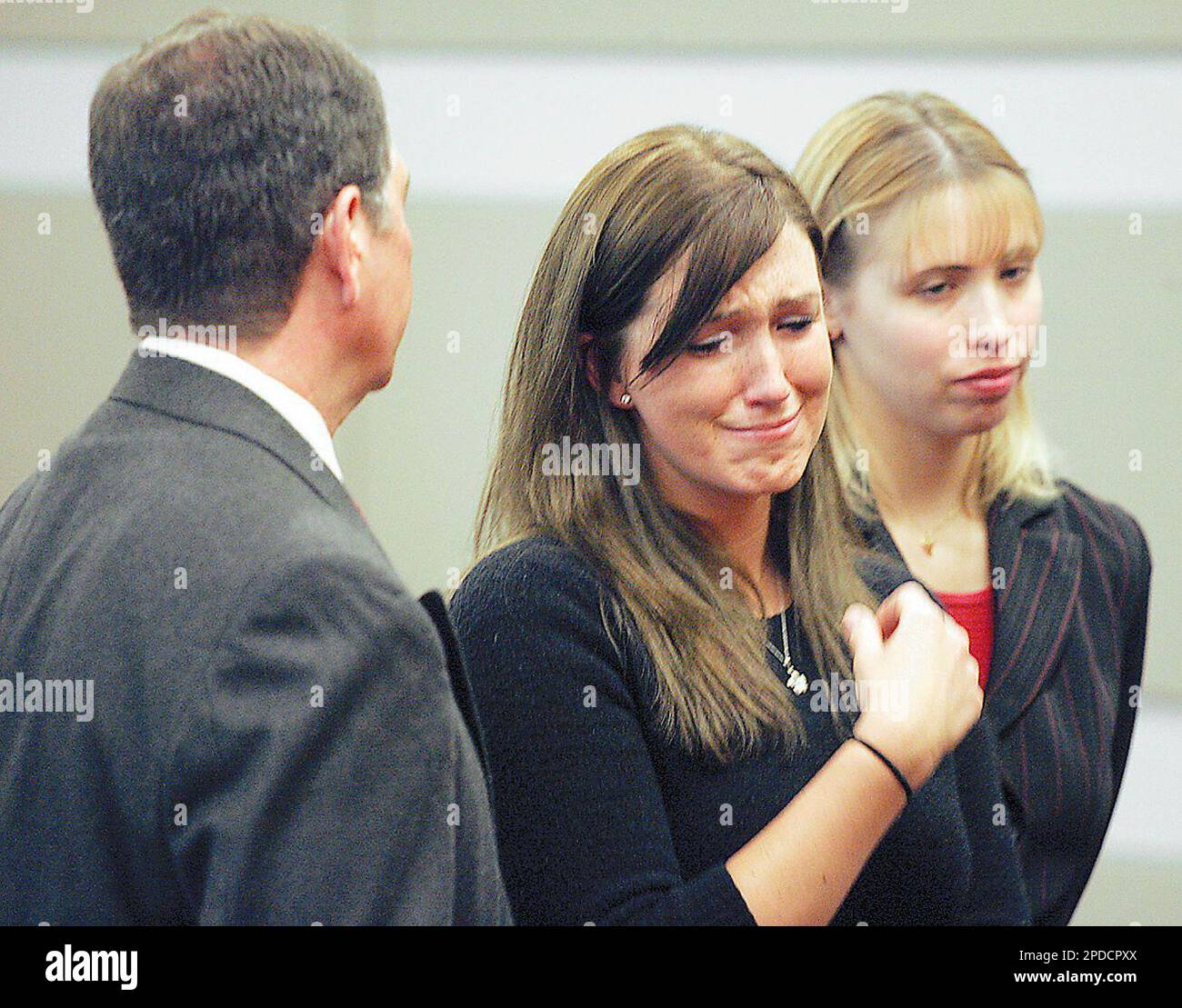 Jessica Coleman, center, reacts with her attorneys' Jack Bradley, left ...