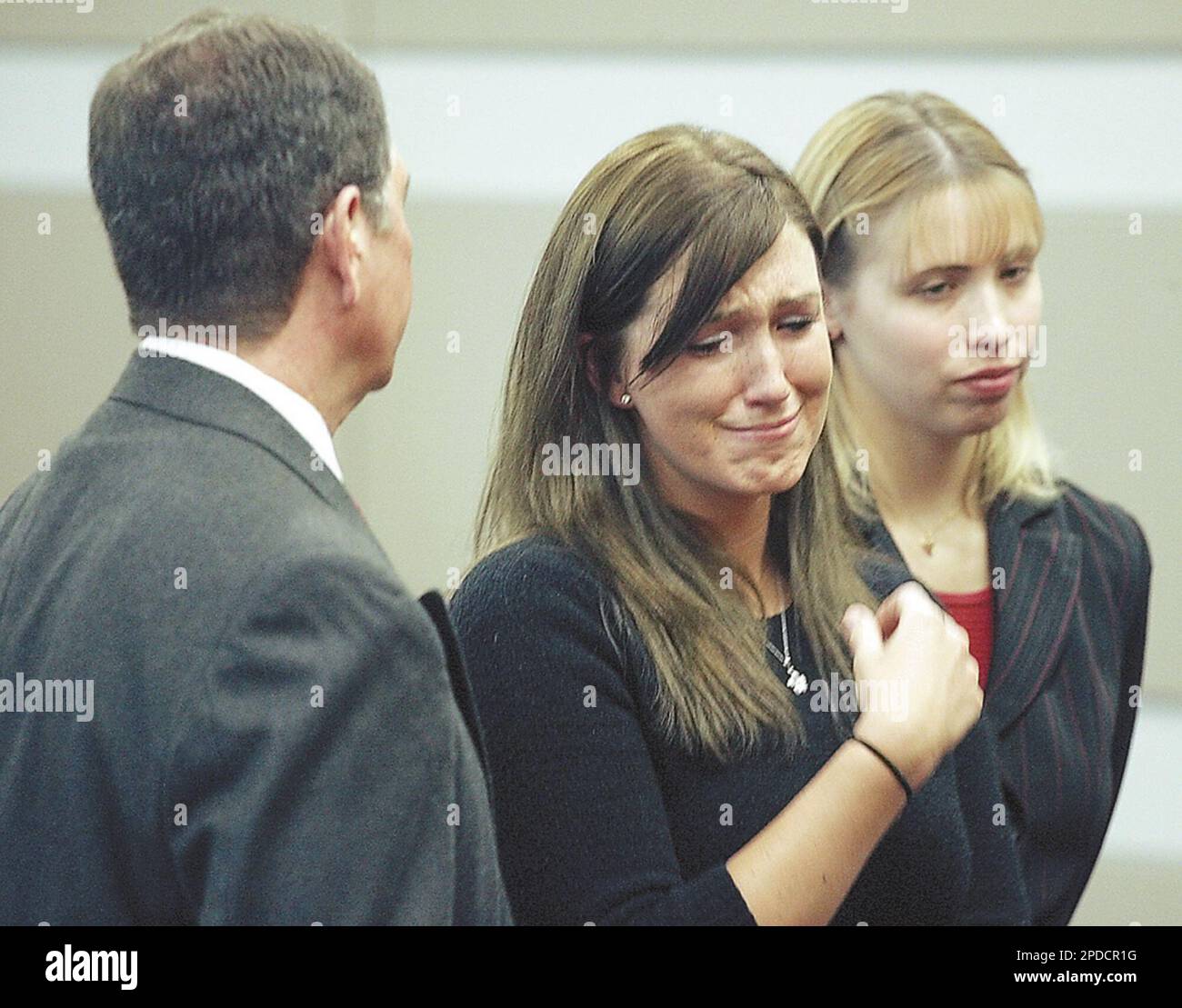 Jessica Coleman, center, reacts with her attorneys' Jack Bradley, left ...
