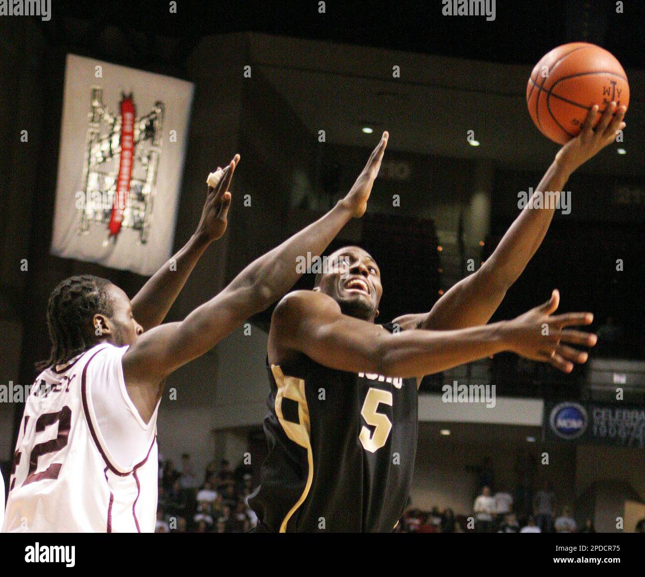 Colorado's Jayson Obazuaye (5) shoots the ball around Texas A&M's ...