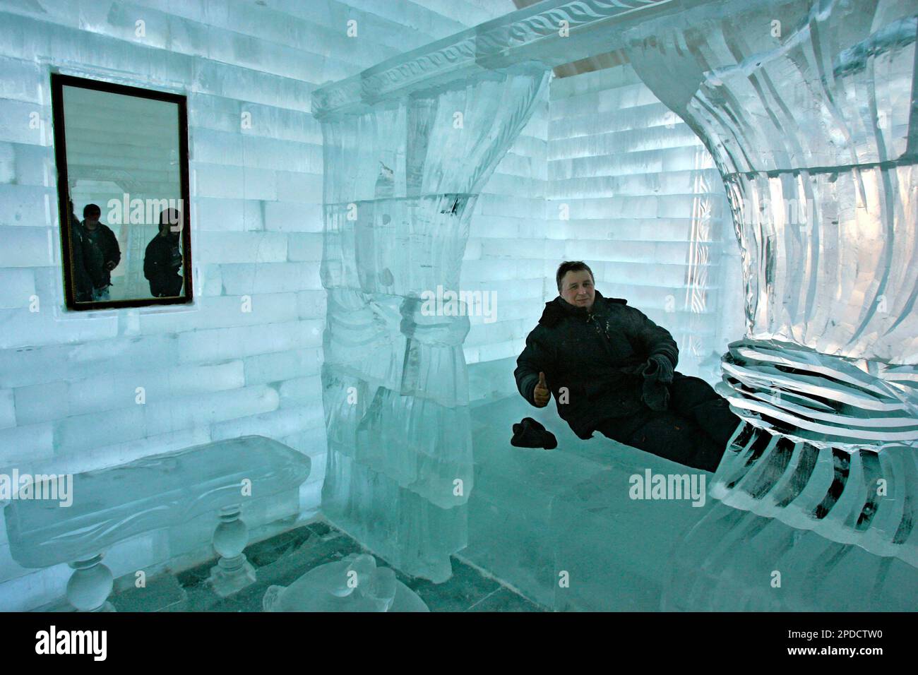 A man lies on an ice bed in an ice palace in St. Petersburg, Russia ...