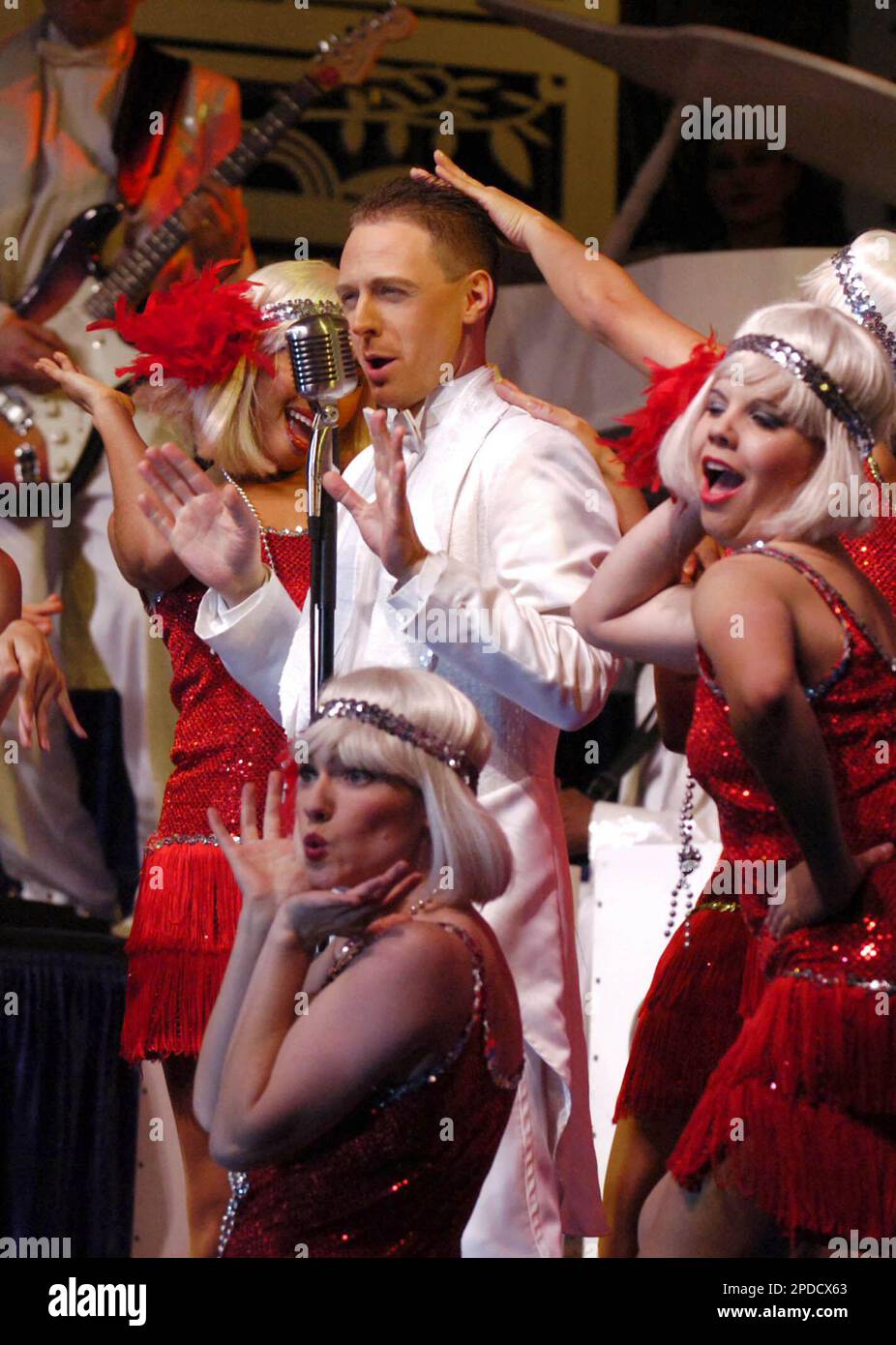 U.S. Air Force Capt. William Middleswart, center, sings during a ...