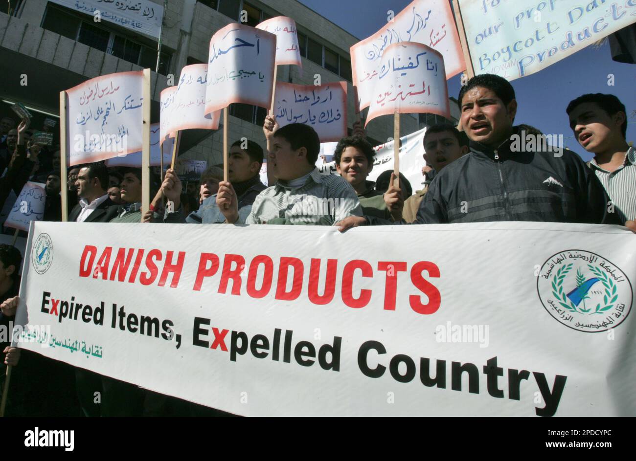 Jordanian protesters hold banners and shout slogans calling for a ...